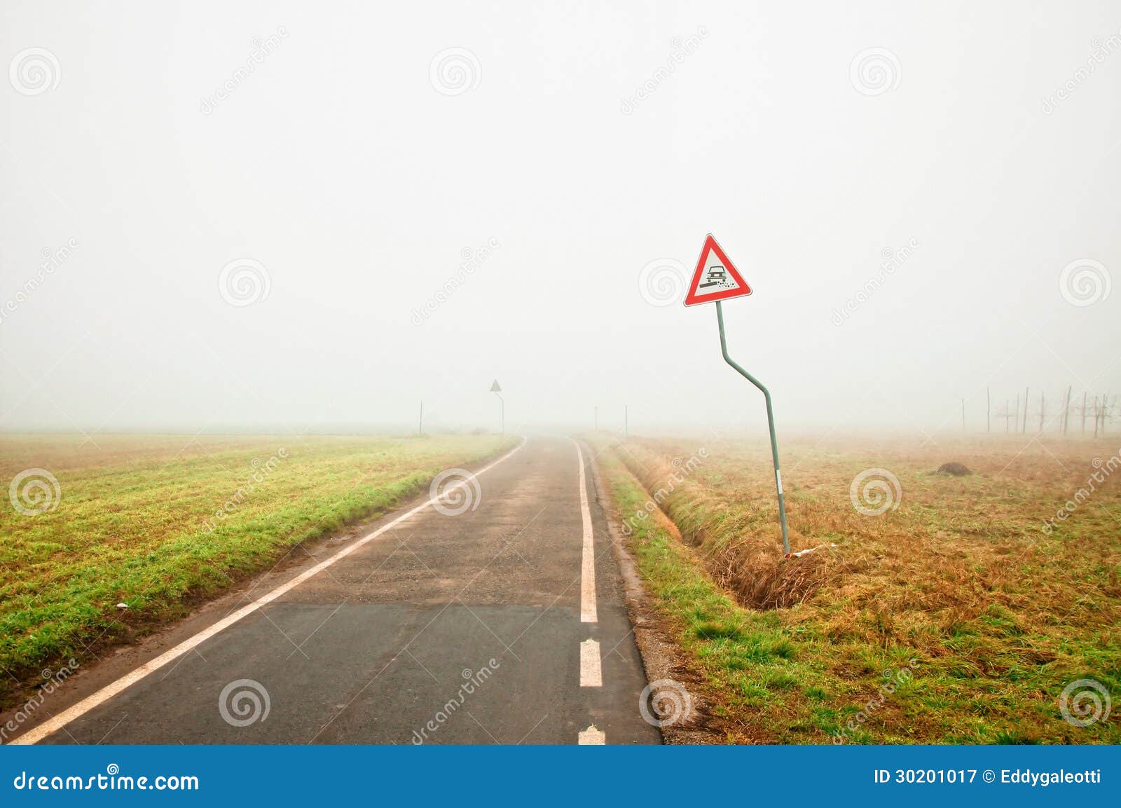 Fog Along Empty Rural Road with Danger Sign Stock Image - Image of ...