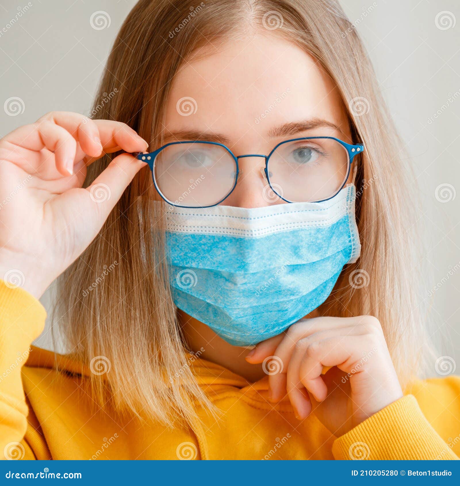 Foggy Glasses Wearing On Young Woman Teenager Girl In Blue Medical Protective Face Mask And