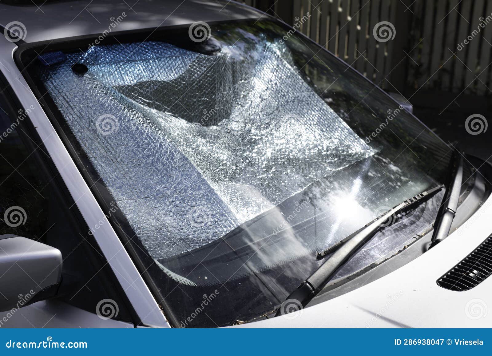Foldable Reflective Sunshade on the Inside of a Car Windshield Stock ...