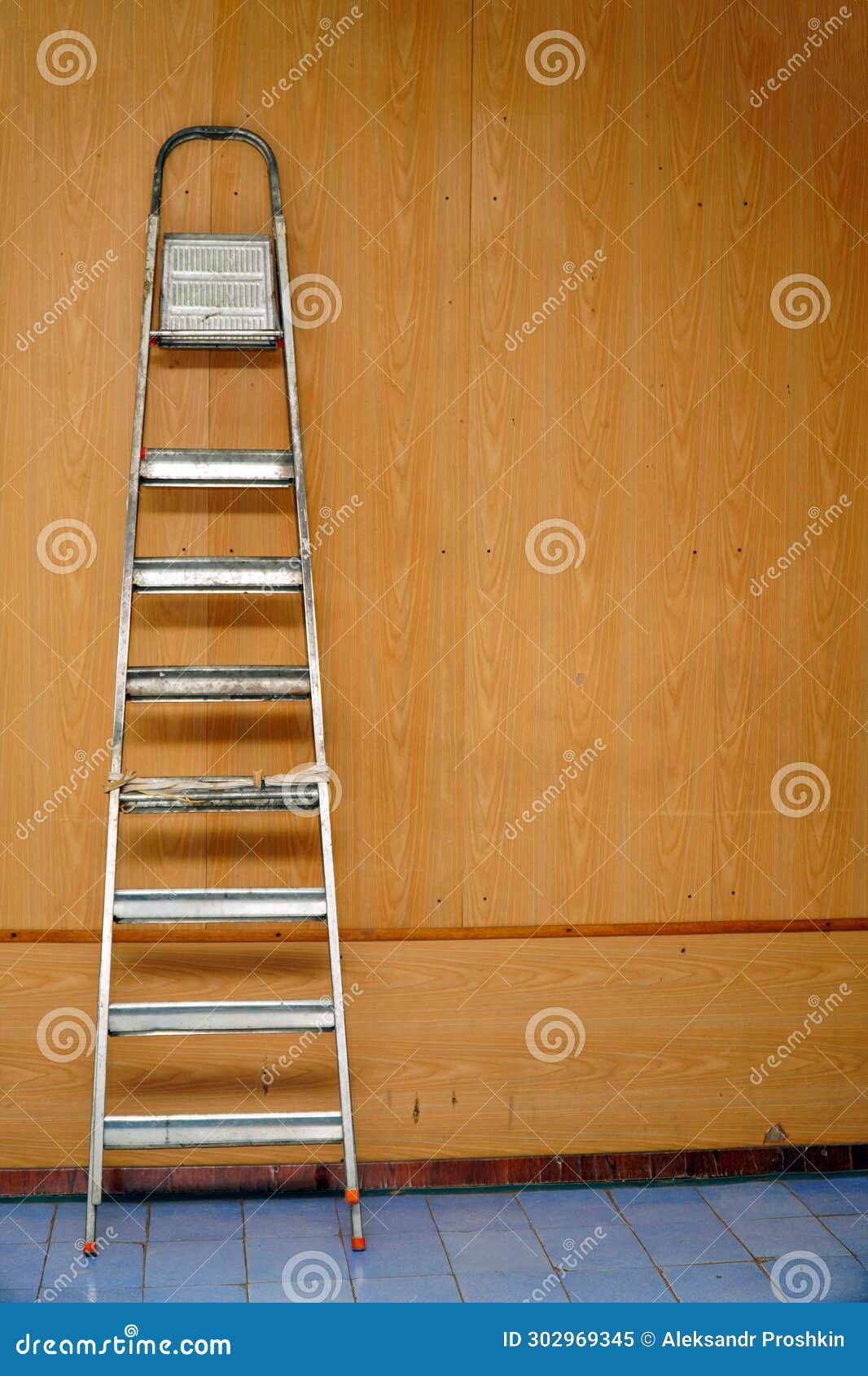 Folded Aluminum Stepladder Stands Against the Wall Stock Image - Image ...
