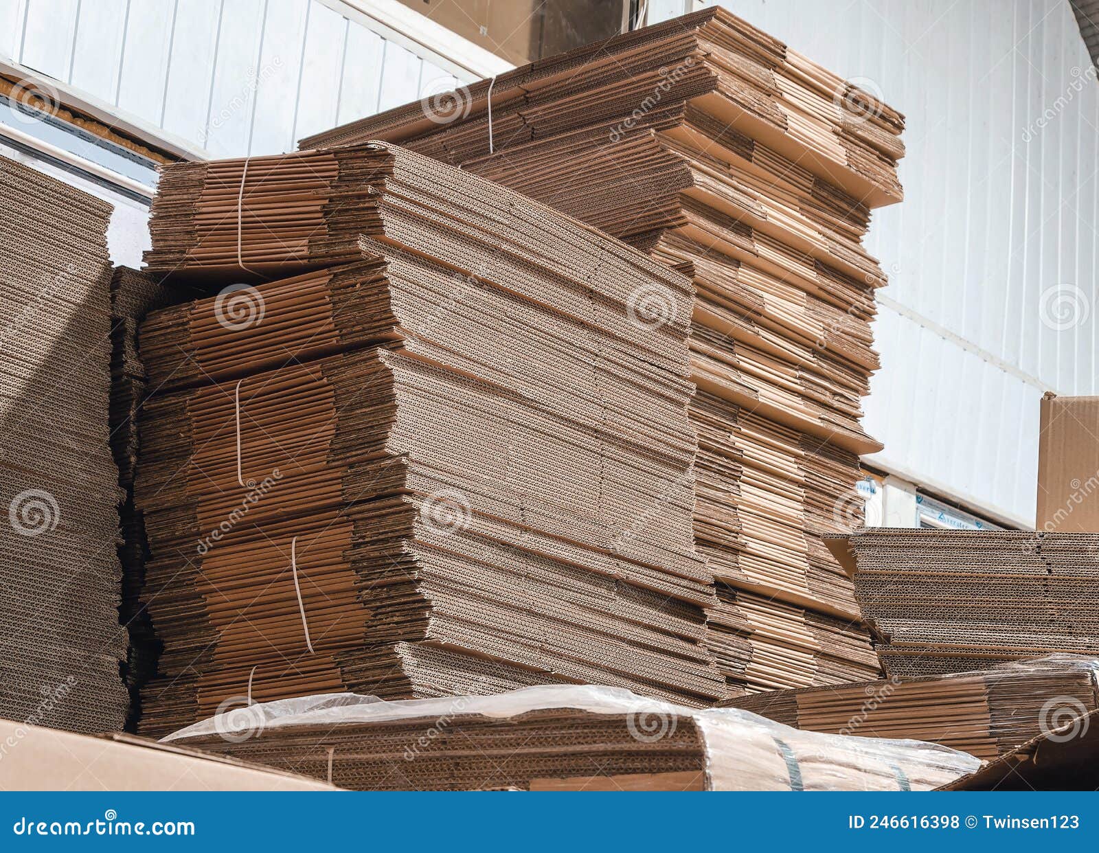 Folded Cardboard Boxes in the Warehouse. Stack of Flat Industrial ...