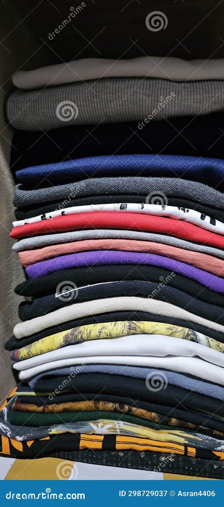 Folded Clothes are Neatly Arranged in the Wardrobe Stock Image - Image ...