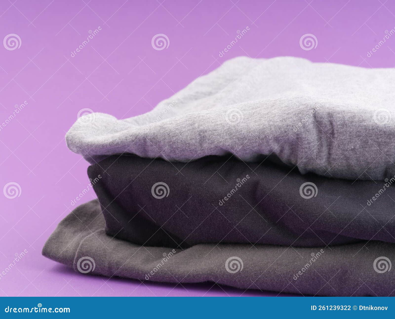 Folded Clothes on a Uniform Background. Space for Text Stock Photo ...