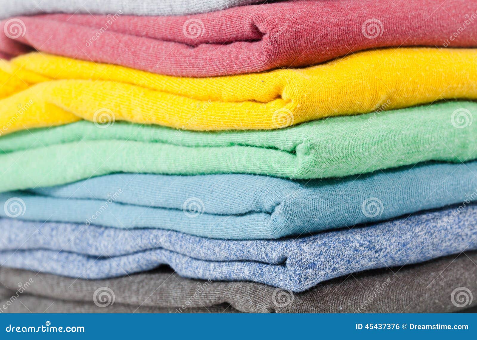 Folded colored shirts stock photo. Image of stack, fabric - 45437376