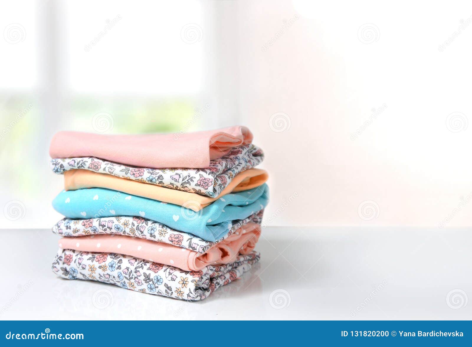Folded Cotton Clothes Stack on Table Empty Background Stock Photo ...