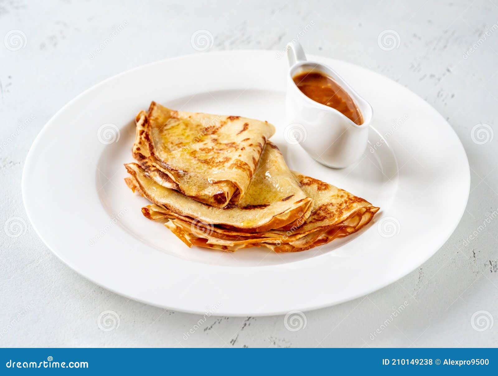 Folded crepes on the plate stock photo. Image of delicious - 210149238