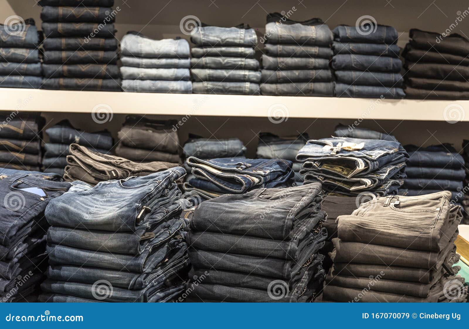 Folded denim jeans stock image. Image of material, label - 167070079