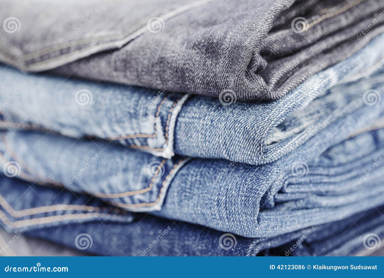 Folded jean stack close up stock photo. Image of shot - 42123086