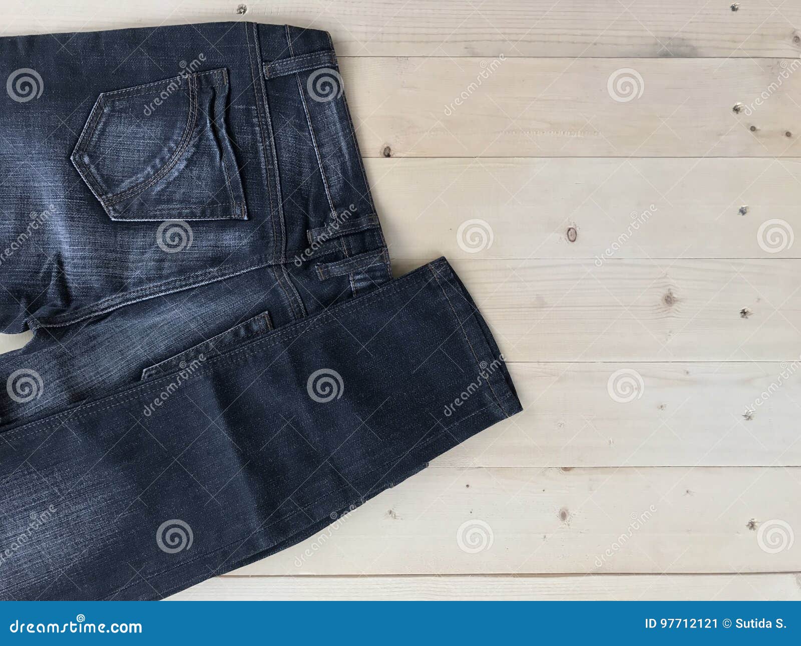 Folded Jeans on Wood Floor with Space for Writing Stock Image - Image ...