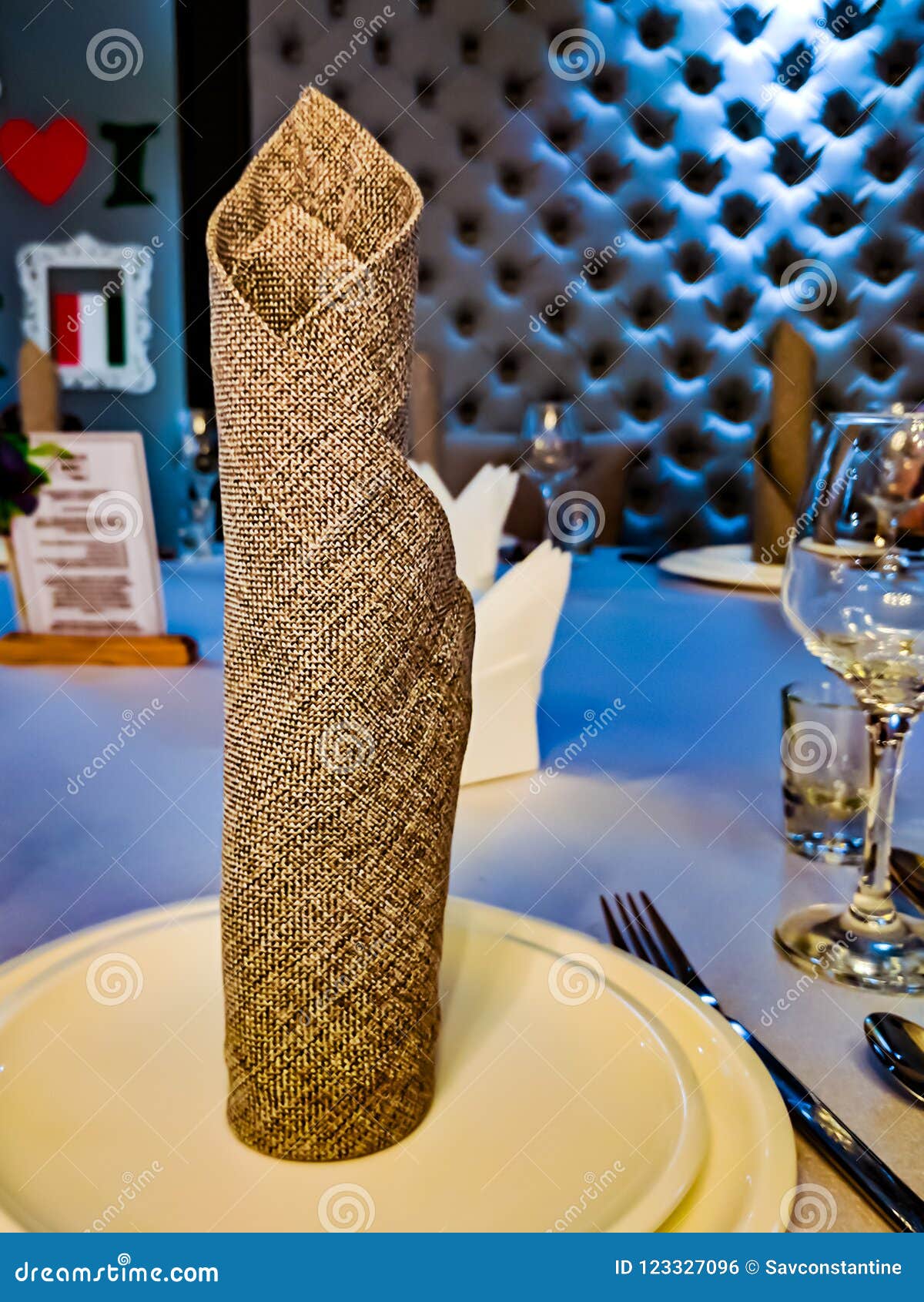 Folded napkin on a plate. stock photo. Image of elegant - 123327096