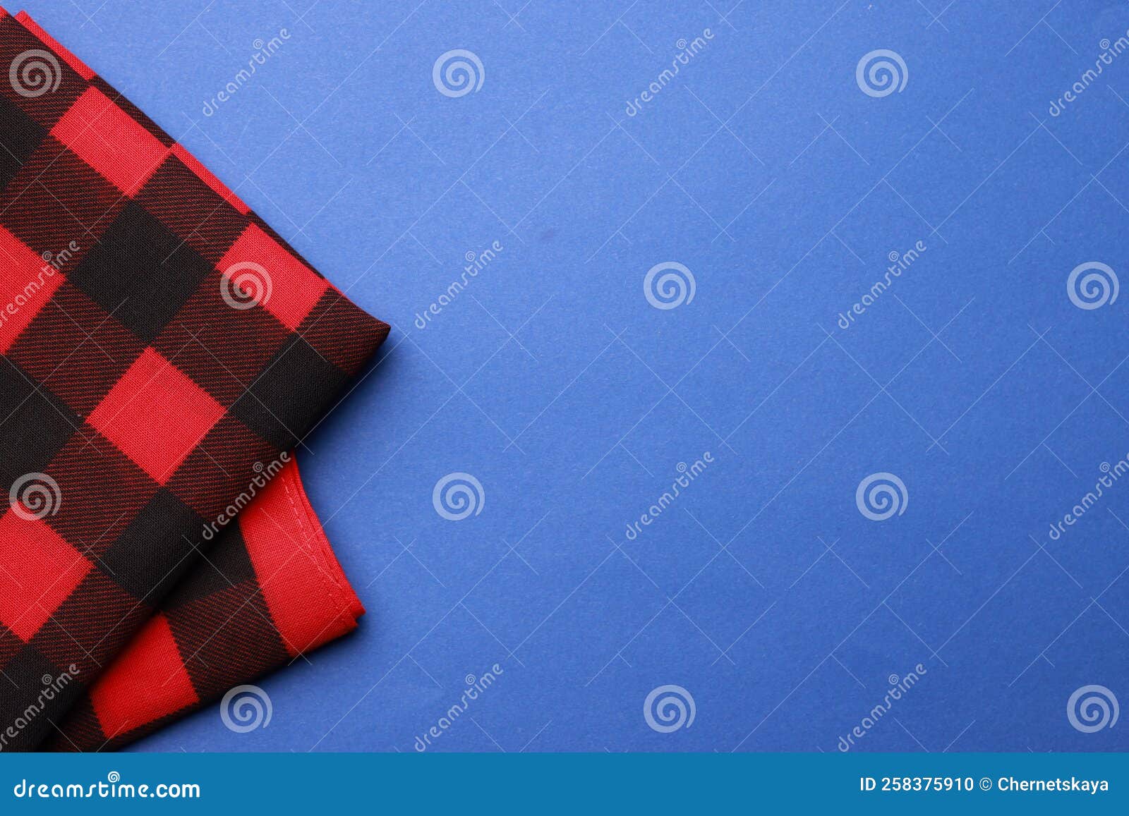 Folded Red Bandana with Check Pattern on Blue Background, Top View ...