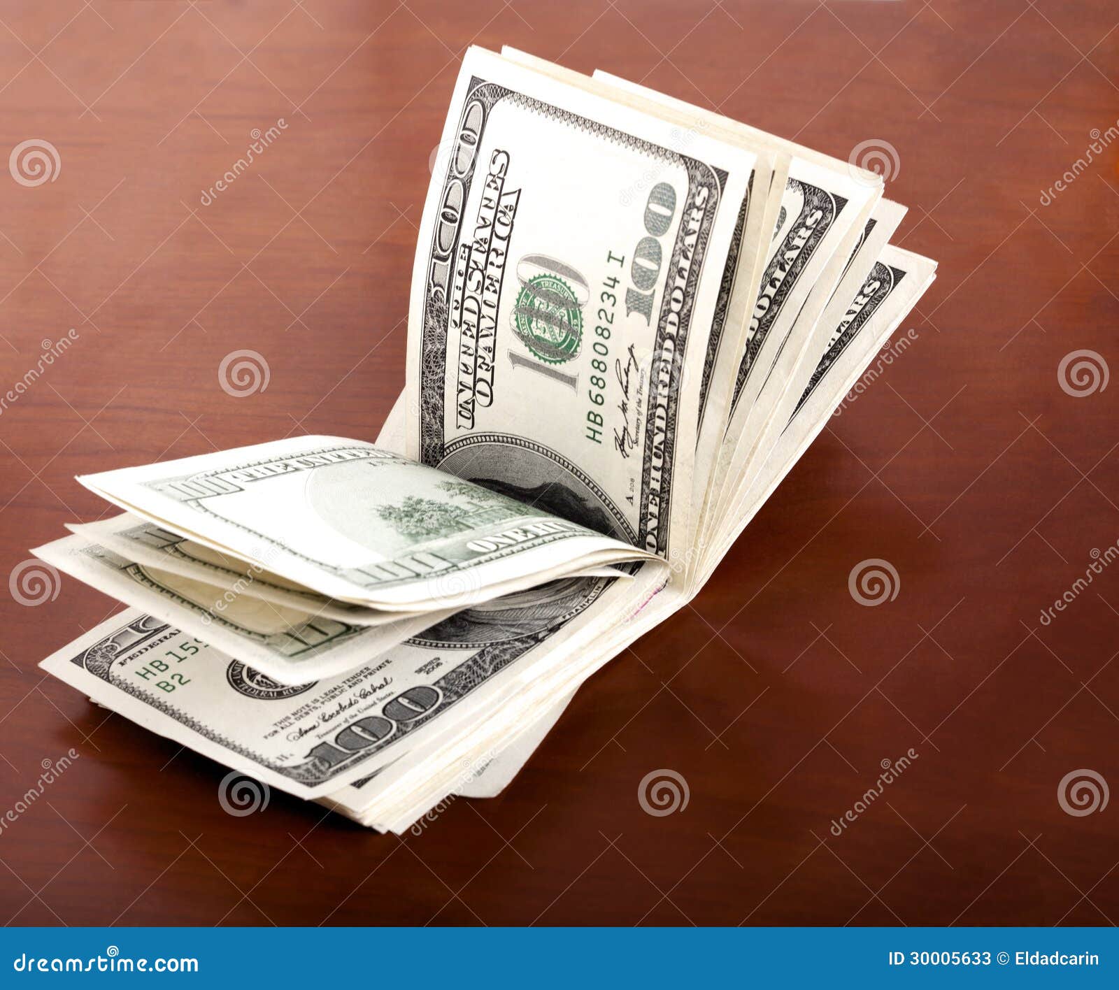 Folded 100 US$ Bills Stack on Brown Background Stock Image - Image of ...