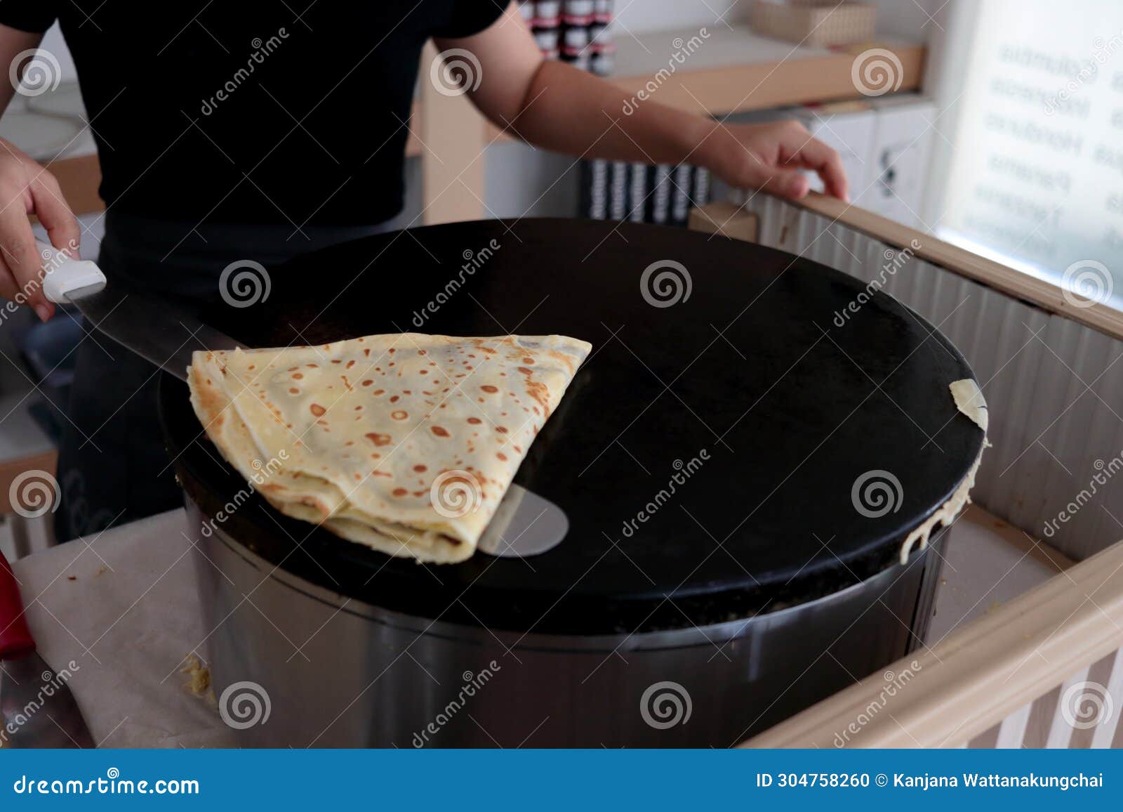 Folded Triangle Shape Crepe on Black Hot Plate. Stock Photo - Image of ...