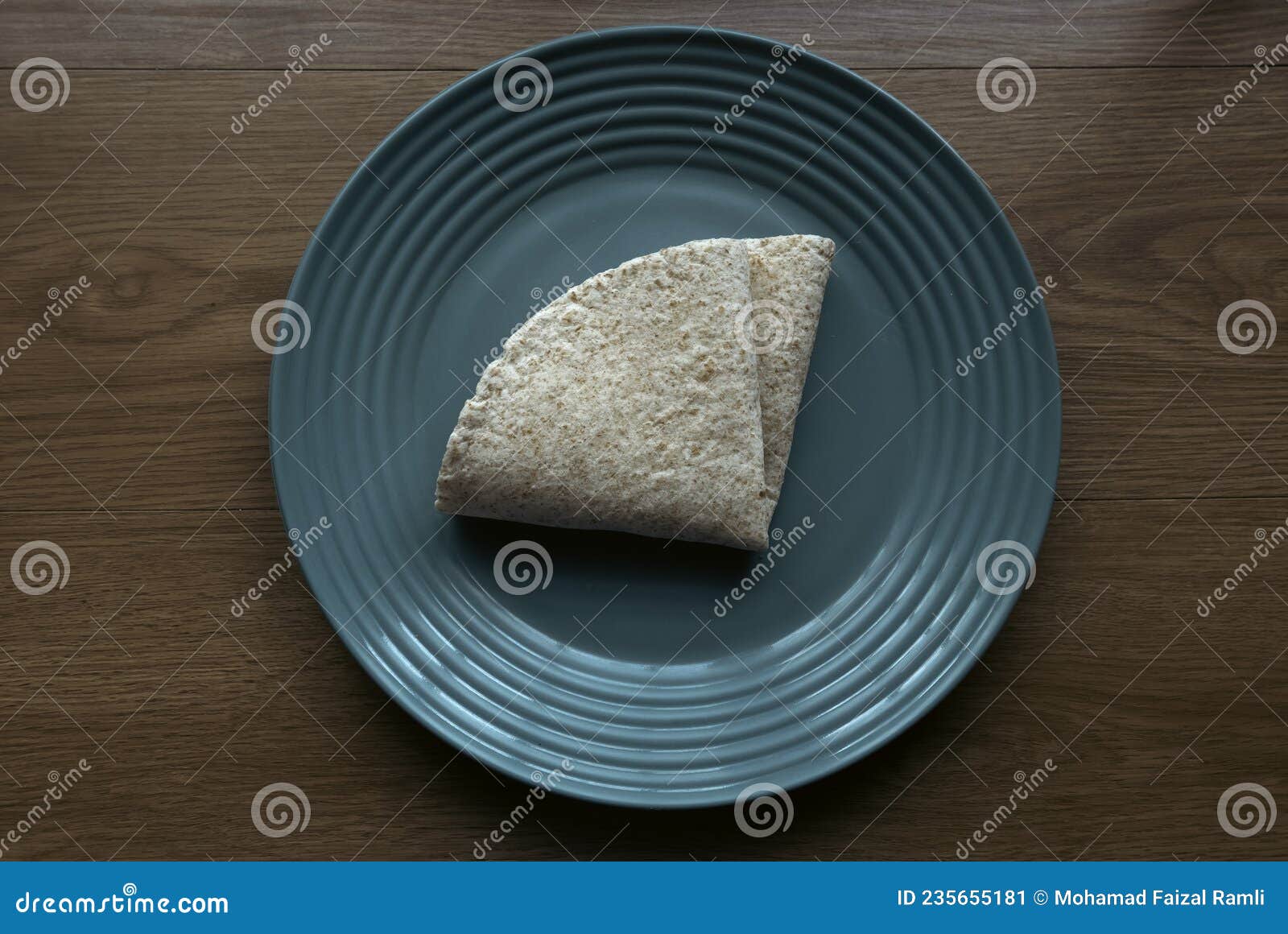 A Folded Wholegrain Wrap on a Green Plate Stock Image - Image of pile ...