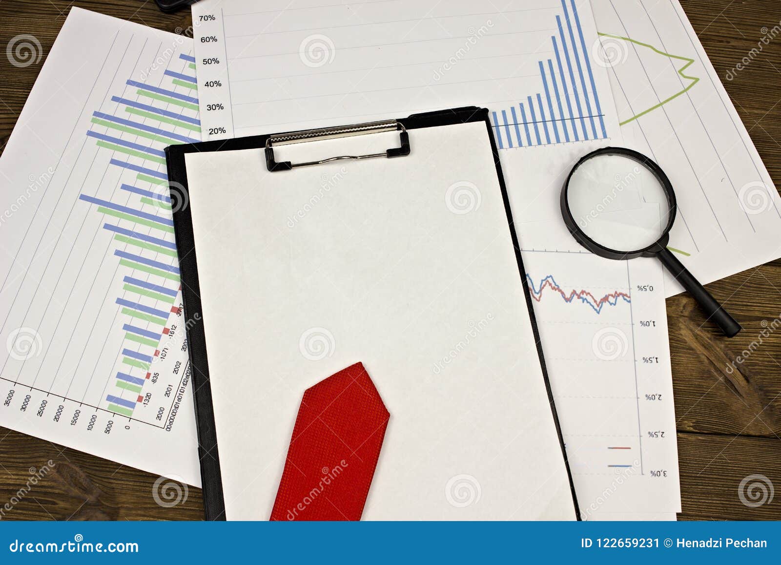 Folder with a Blank Sheet, Graphics and Magnifier, Red Tie Office Stock ...