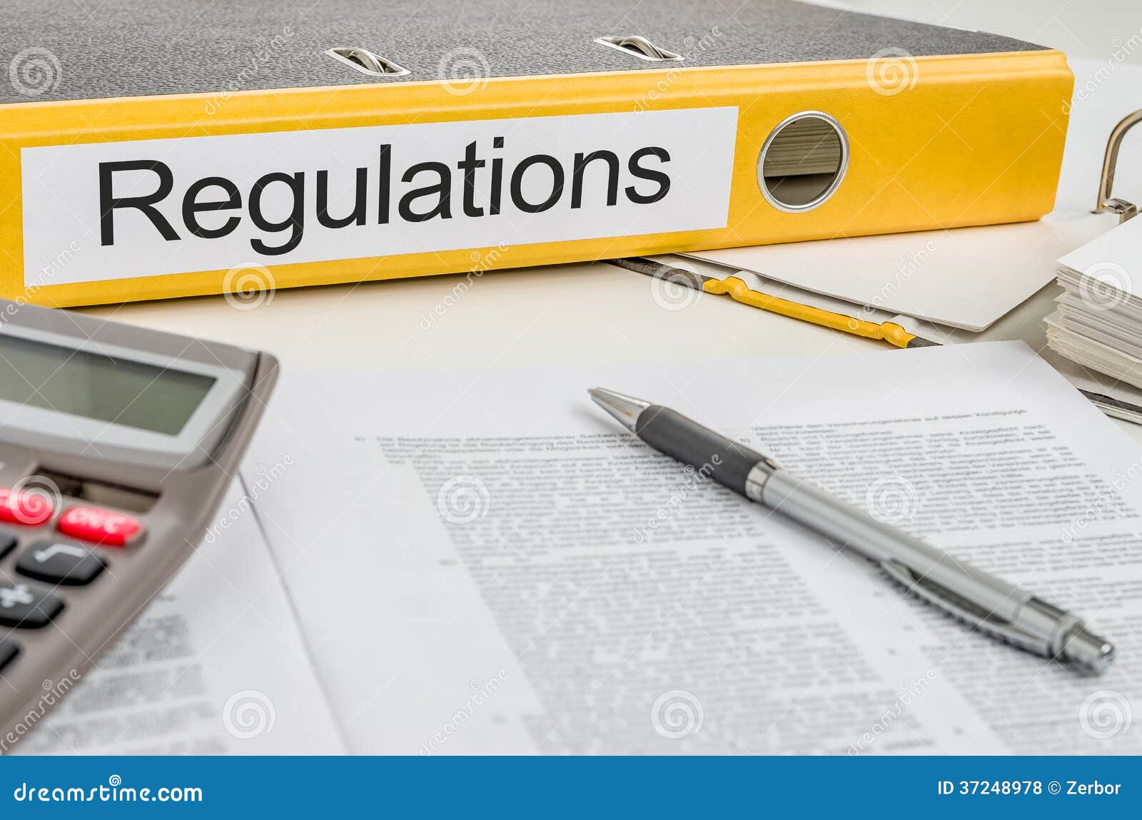 A Folder with the Label Regulations Stock Photo - Image of folders ...