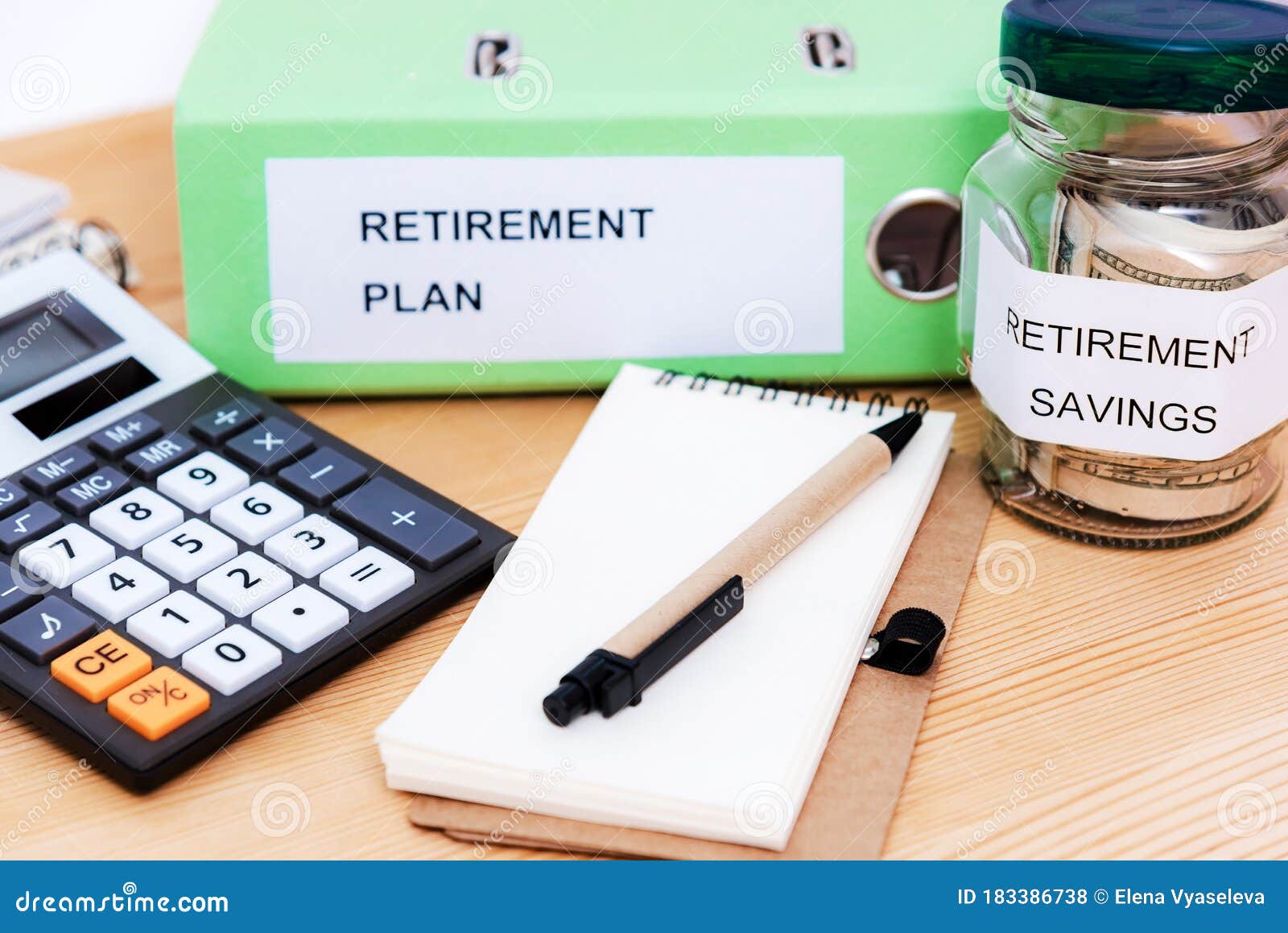 Folder with the Label Retirement Plan, Money, Notepad and Pan on Wooden ...