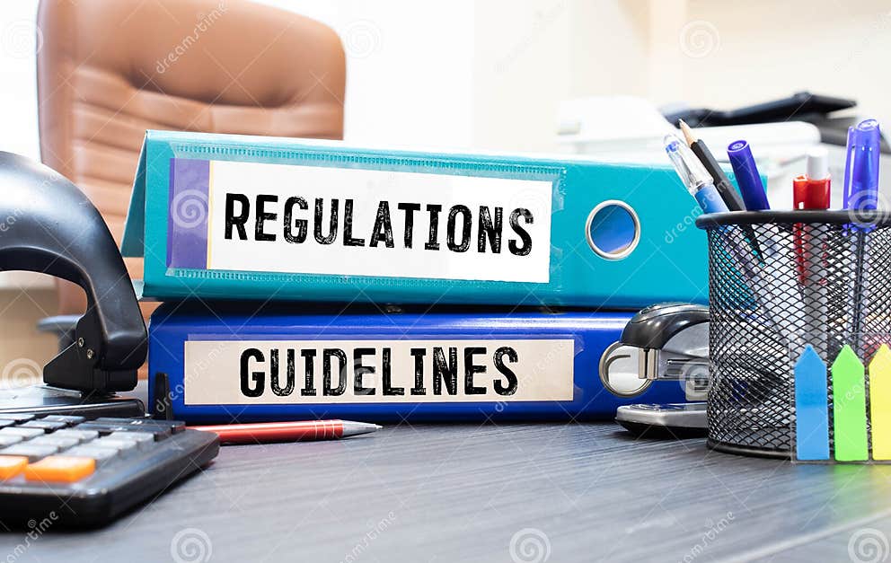 Folders with the Label Regulations and Guidelines Stock Photo - Image ...