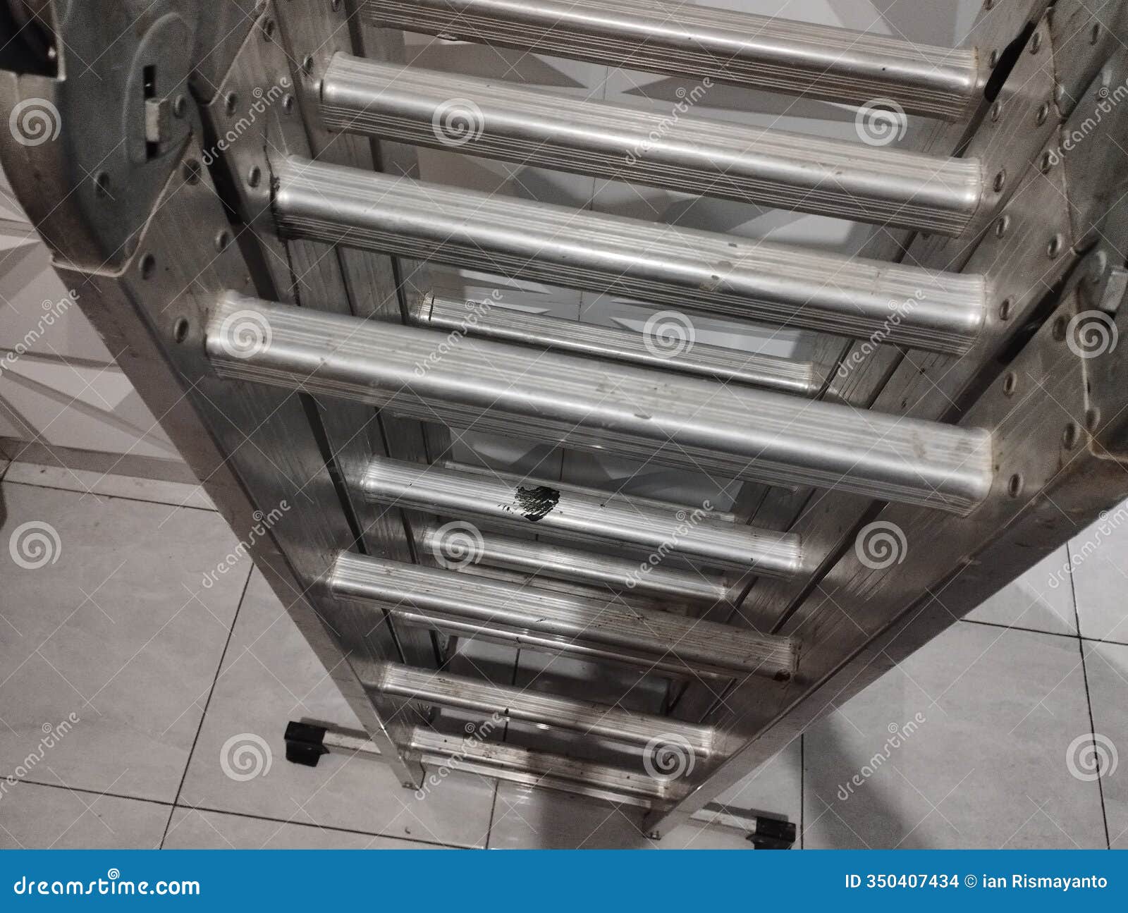 Aluminium Folding Ladder. Step Ladder On White Wall Background Royalty ...