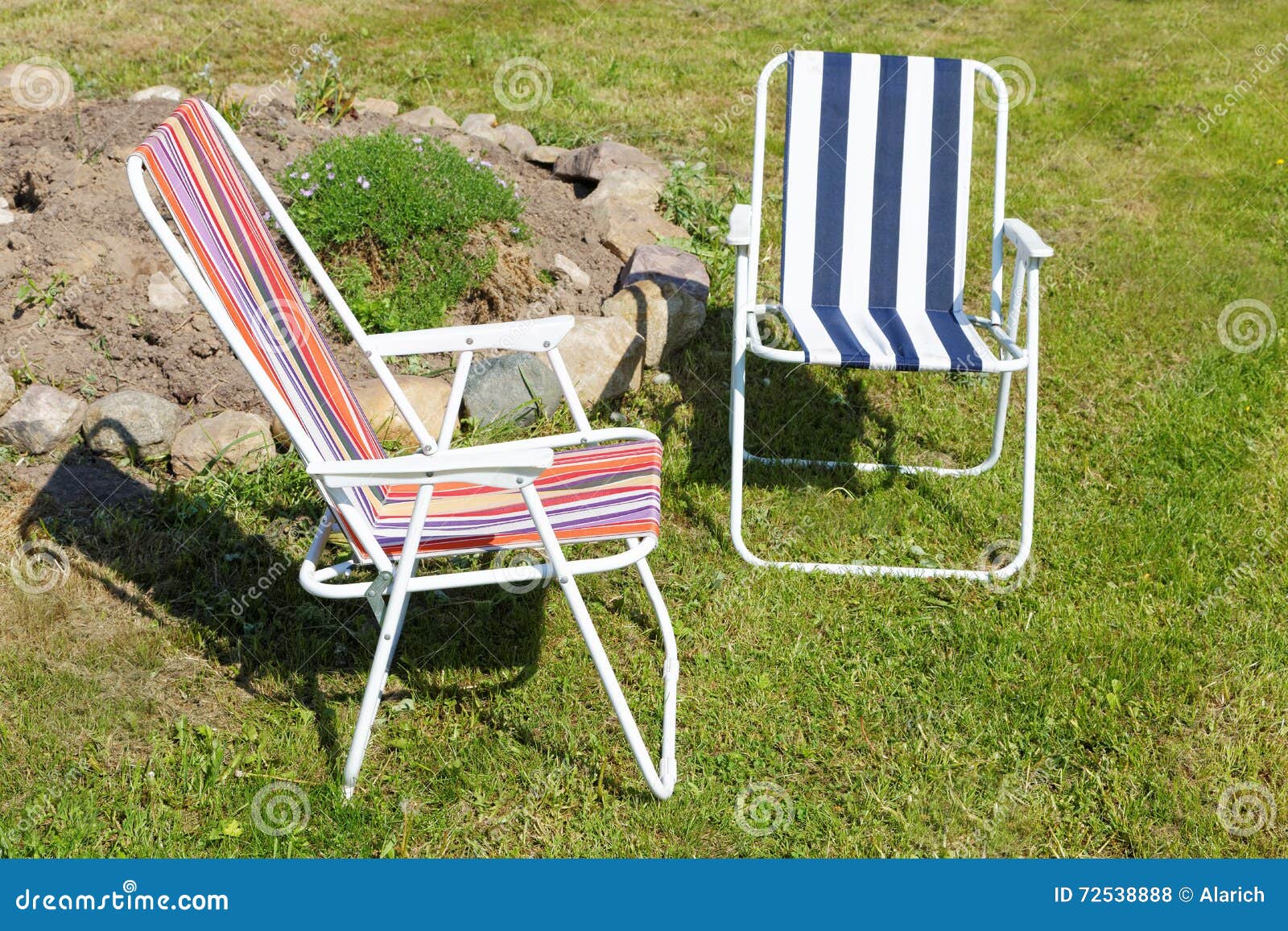 Folding Chairs on the Lawn in the Spring Stock Photo - Image of ...