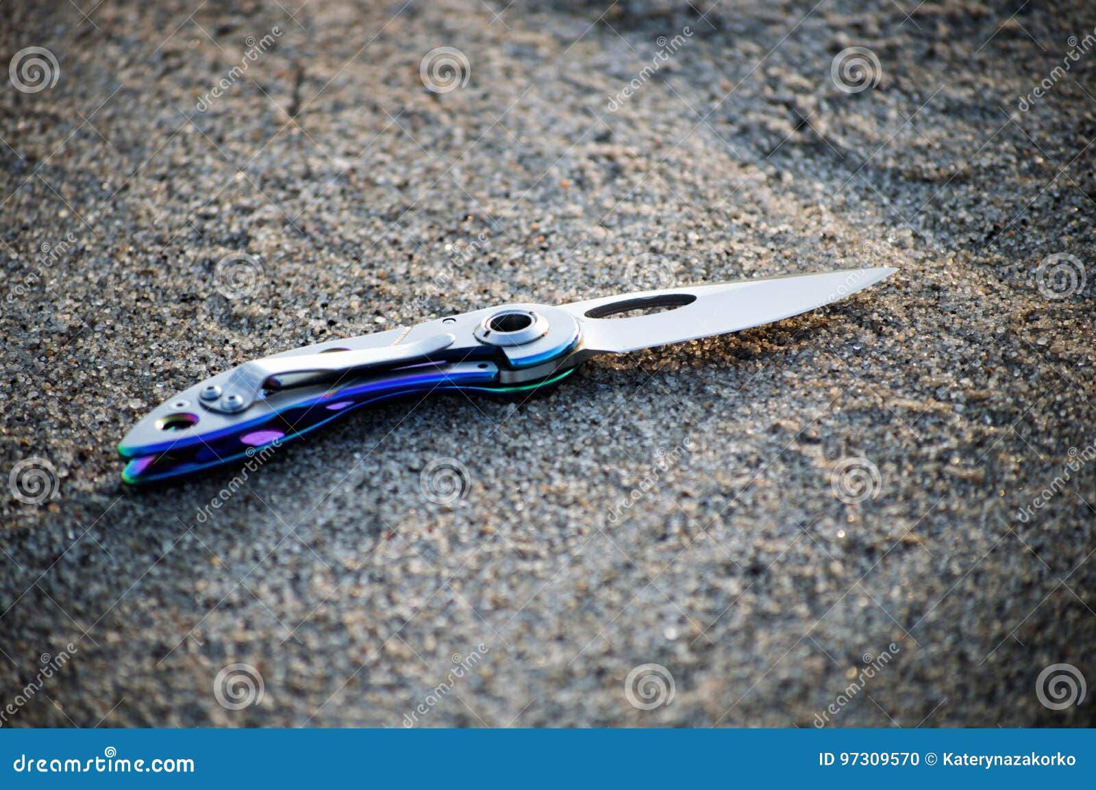 Folding knife on the sand stock photo. Image of sharp - 97309570
