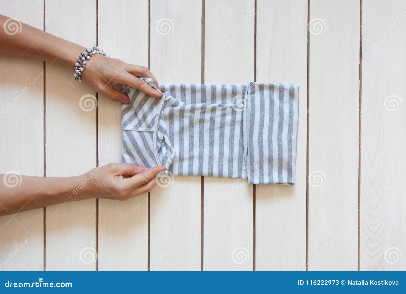 Folding the T-shirt. Keeping Things in the Japanese System Stock Image ...