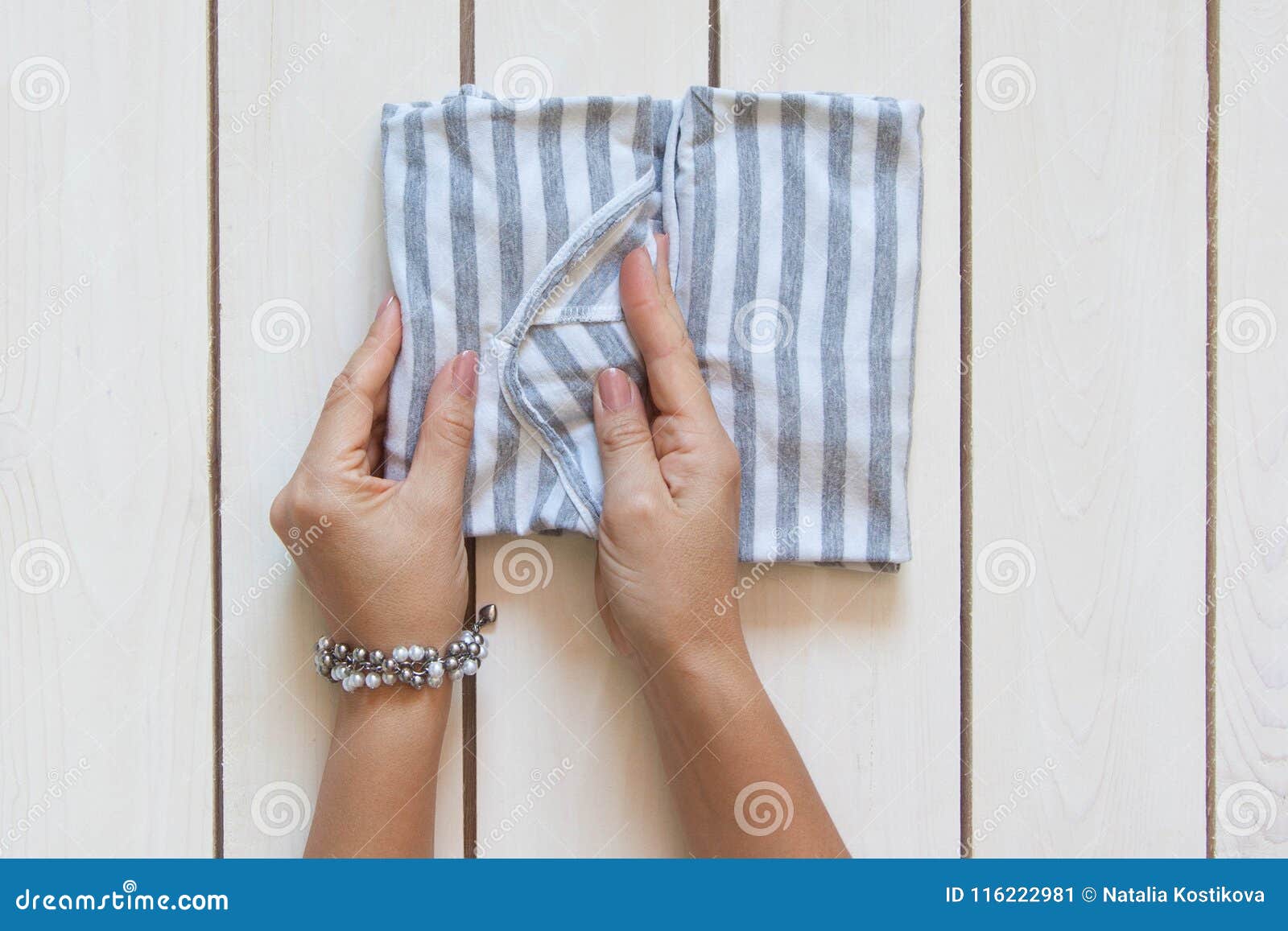 Folding the T-shirt. Keeping Things in the Japanese System Stock Image ...
