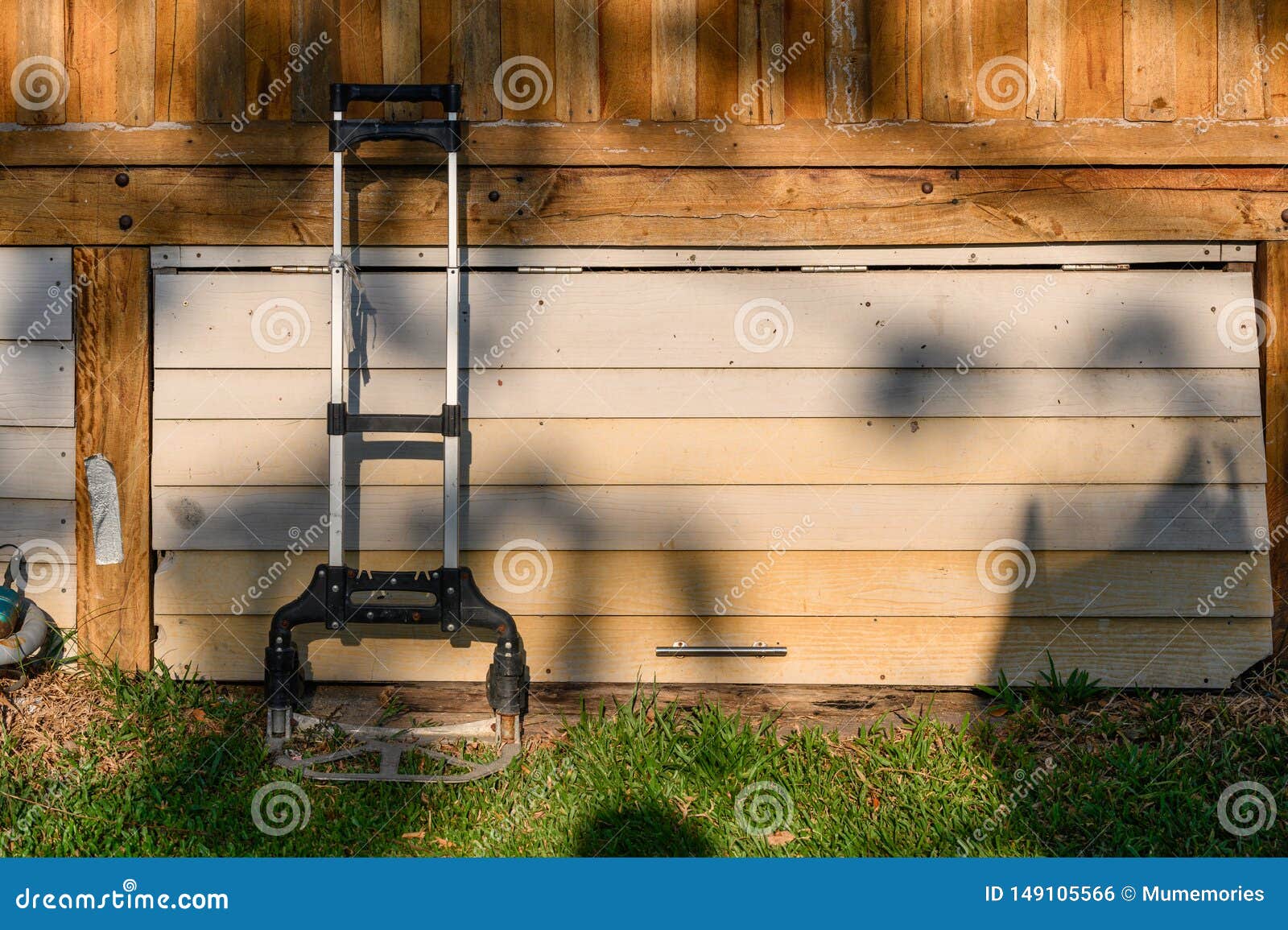 Folding Trunk Trolley on Wooden Wall with Storage Box Stock Photo ...