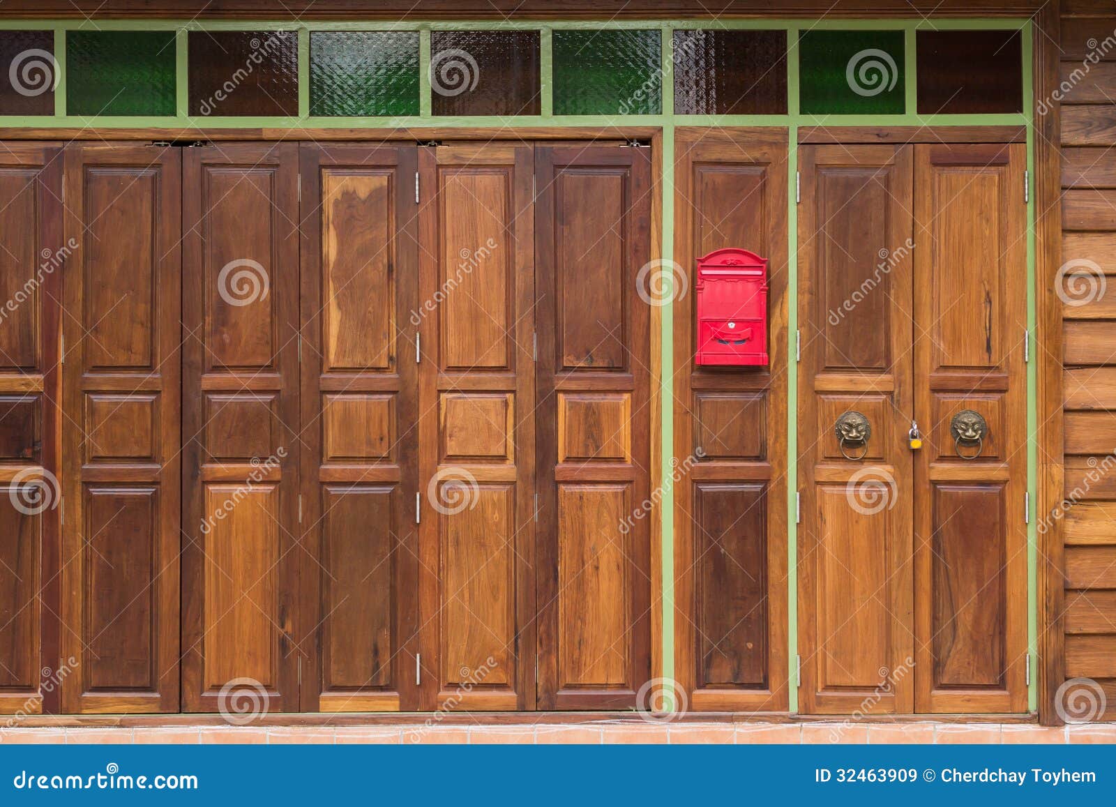 Folding Wooden Doors Have a Light Red Mailbox Stock Image - Image of ...