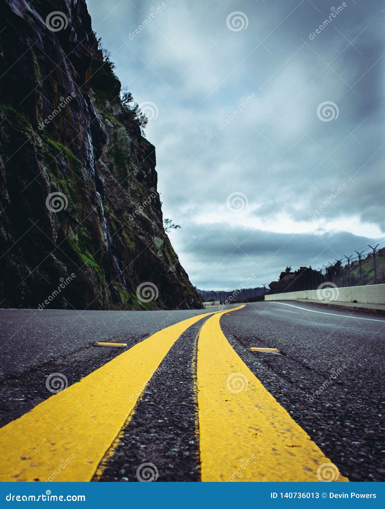 Follow the yellow lines stock image. Image of road, cloudy - 140736013