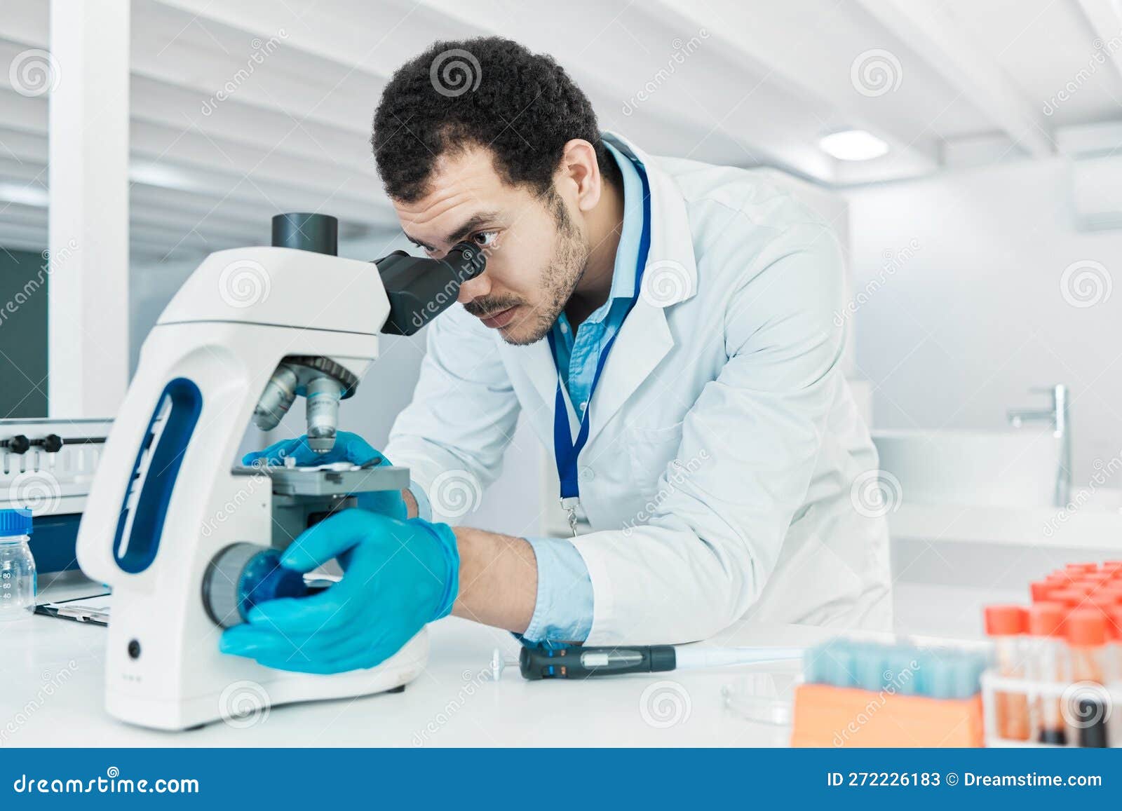 Following Careful Analytical Processes. a Young Scientist Using a ...