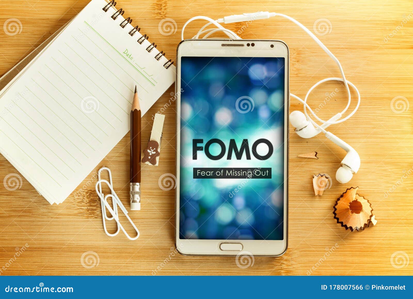 FOMO , Fear of Missing Out Text on Smart Phone with a Blank Notepad and ...