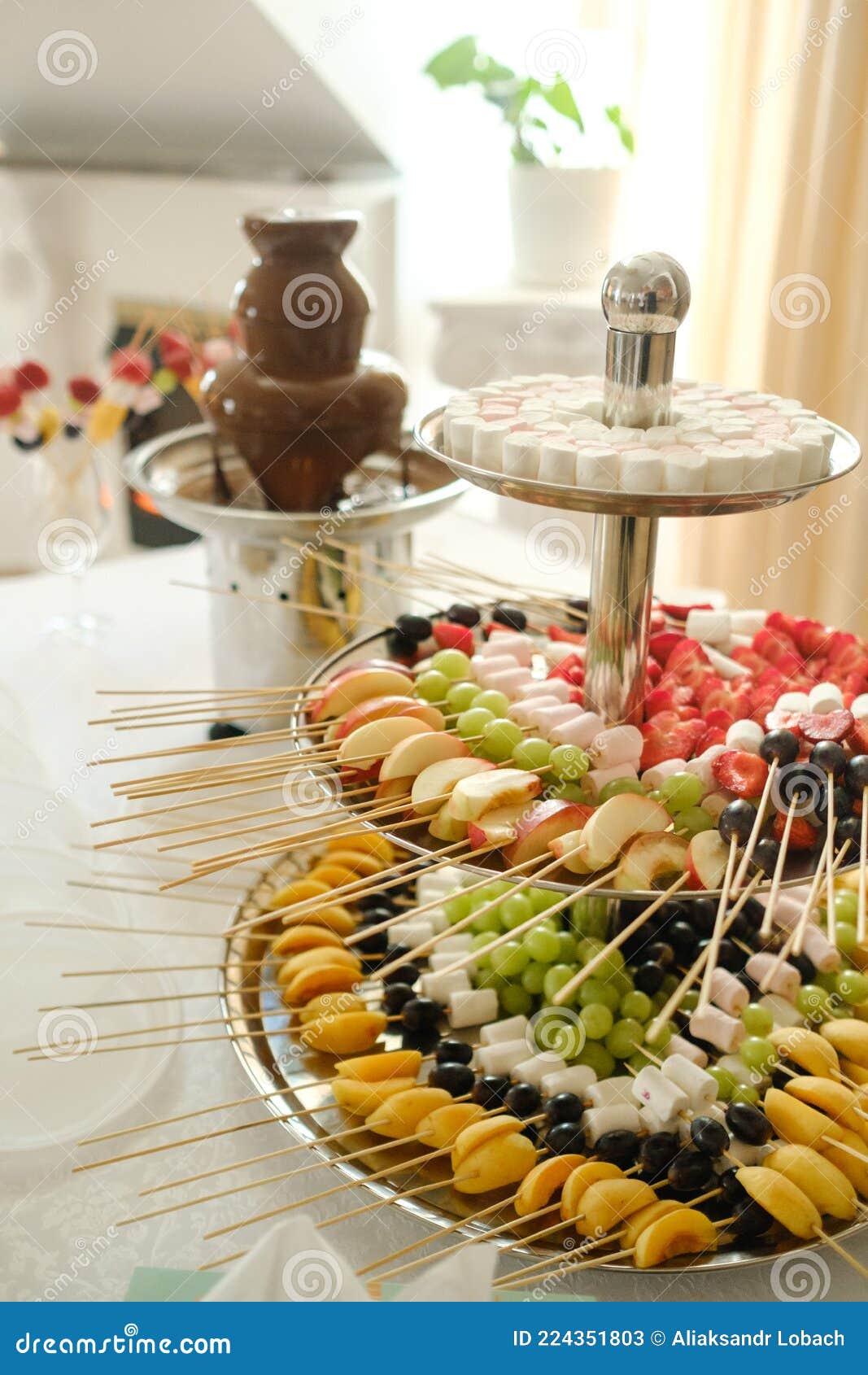 Fondue with a Chocolate Fountain and Sweets for it.Sweet Theme Stock ...