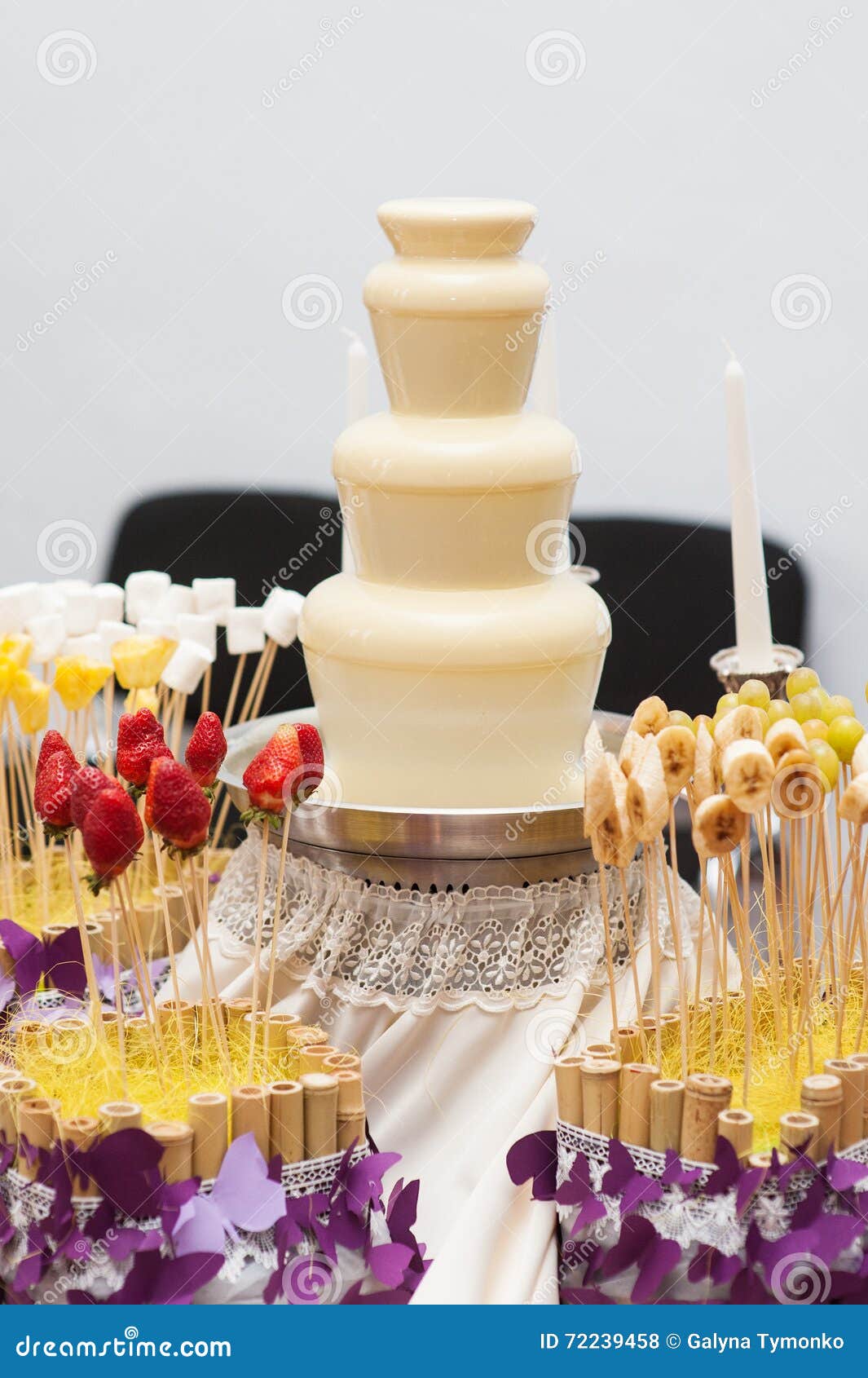 Fondue Fountain of White Chocolate Being Dipped Stock Photo - Image of ...