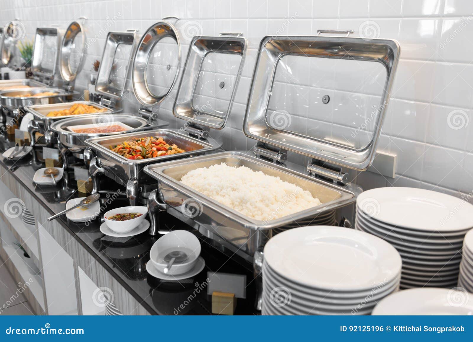 Food on Buffet Table with Dishware Stock Photo - Image of shallow ...