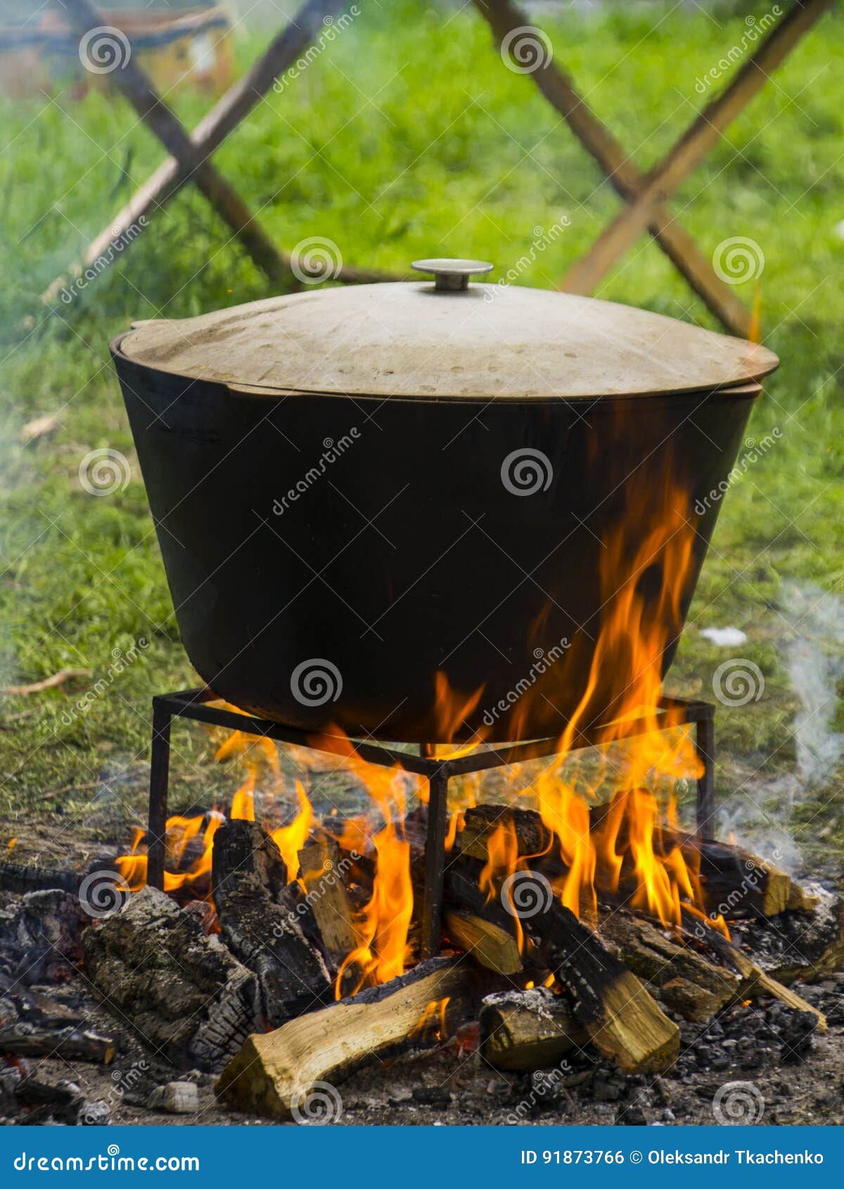 Food in a Cauldron on a Fire. Cooking Outdoors in Cast-iron Cauldron ...