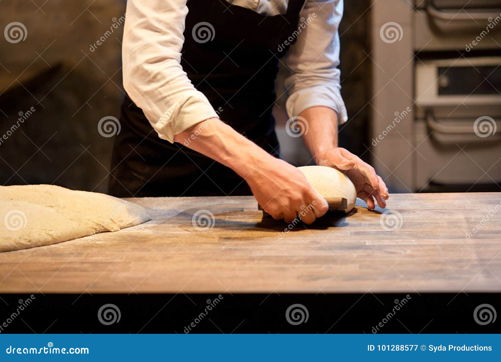 Baker Portioning Dough with Bench Cutter at Bakery Stock Image - Image ...