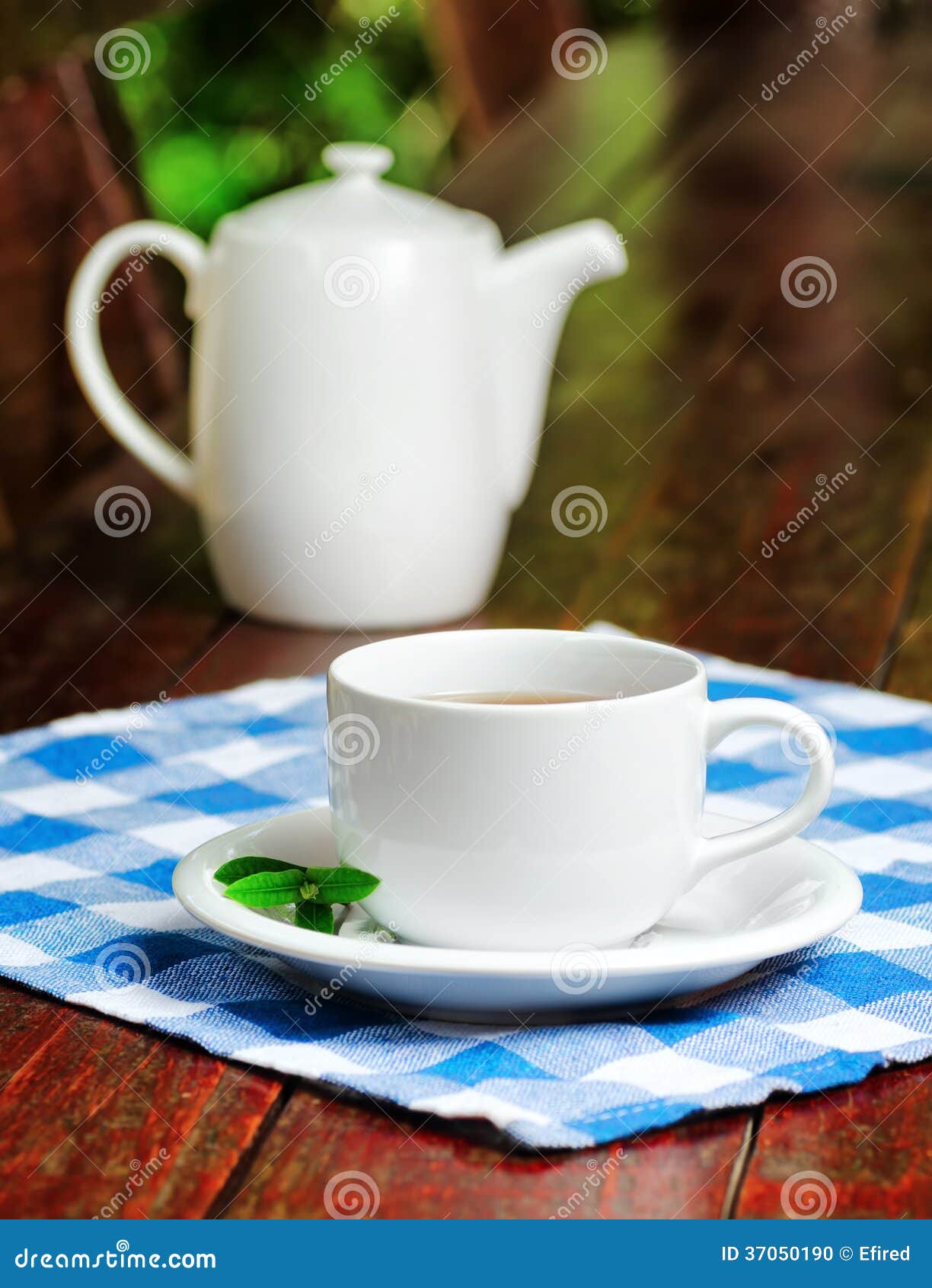 Cup of tea on wooden table stock photo. Image of herbs - 37050190
