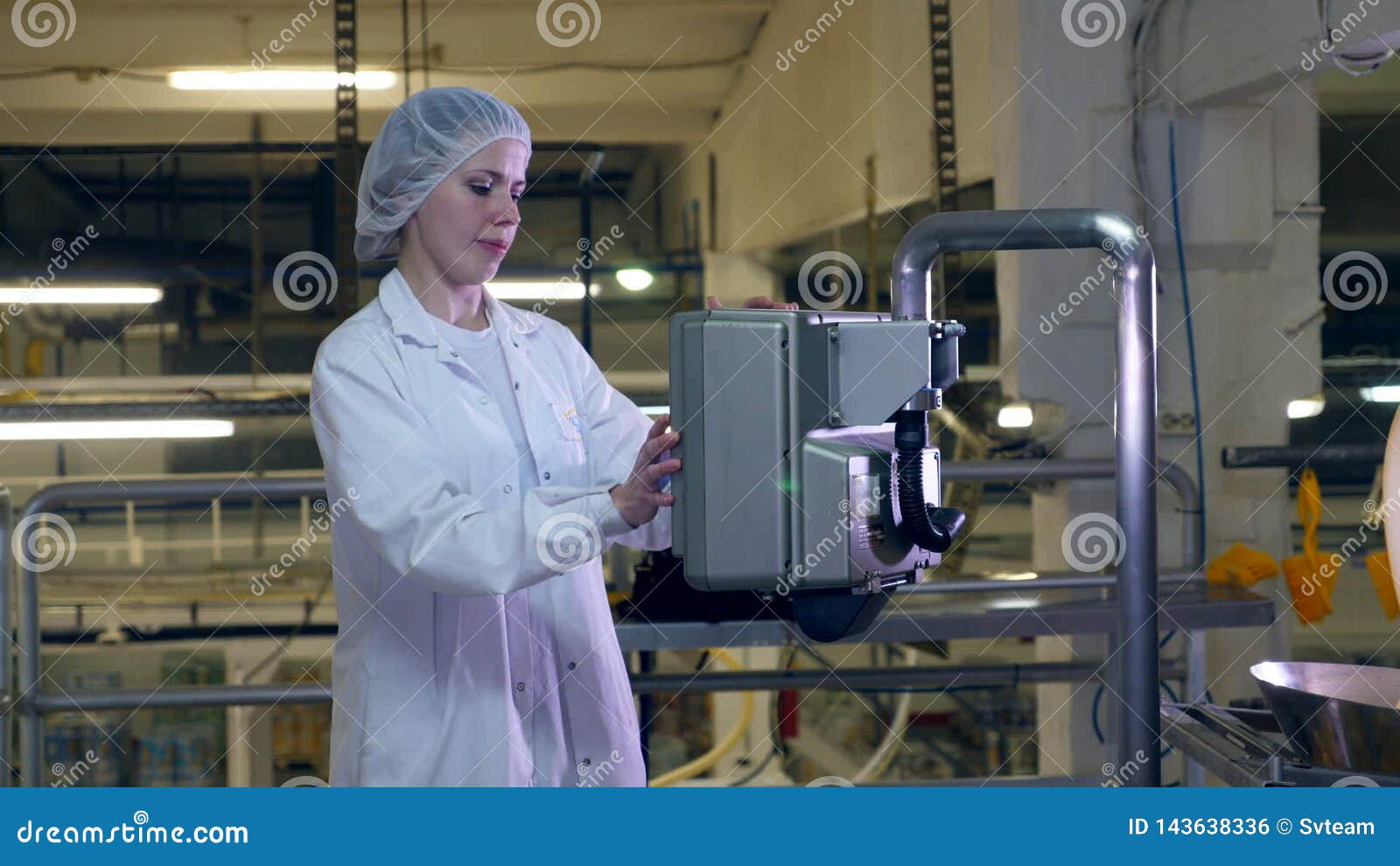 Food Factory Worker Controls a Conveyor, Using a Machine. Stock Footage ...