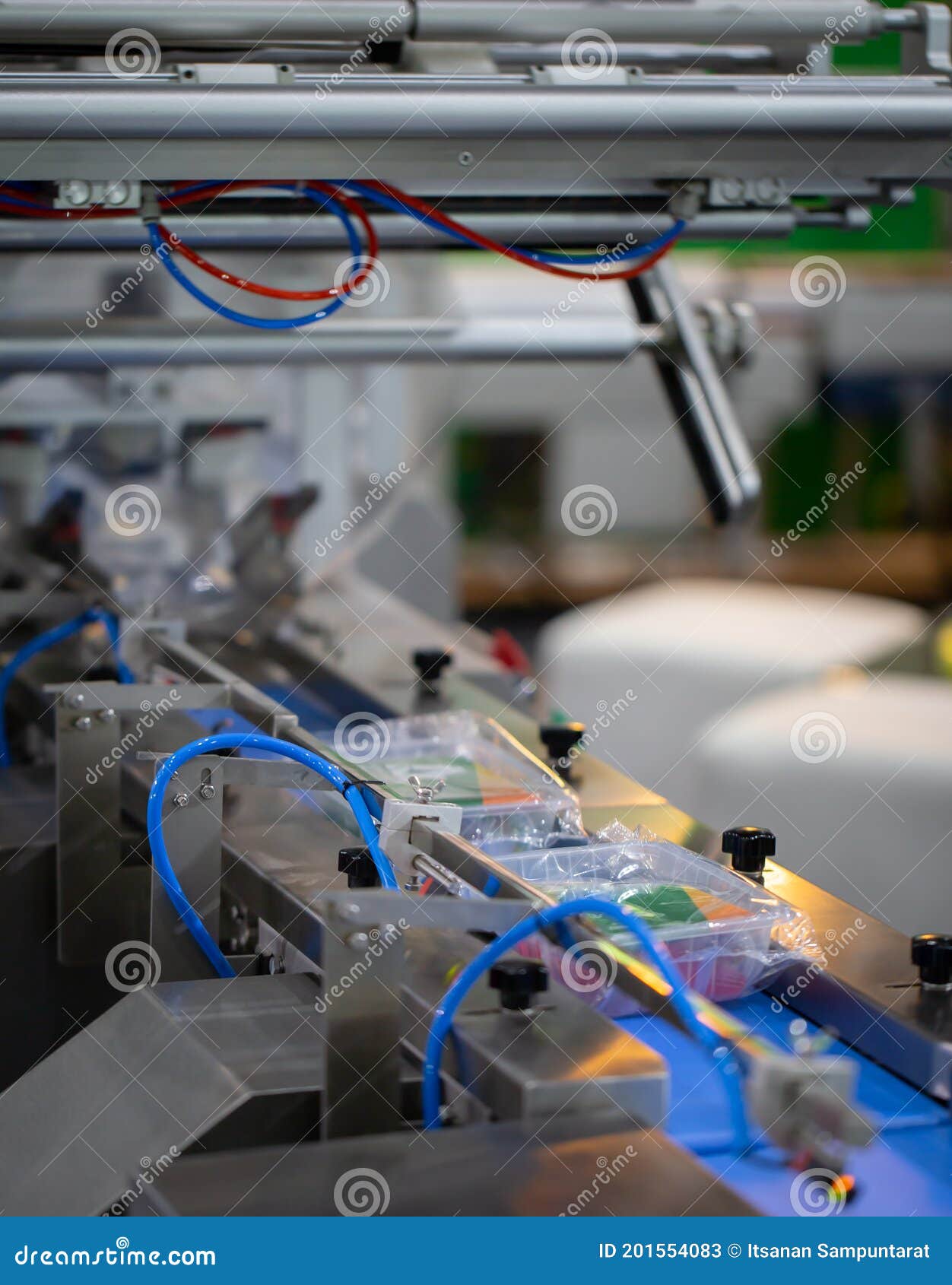 Food flow packing machine stock image. Image of film - 201554083