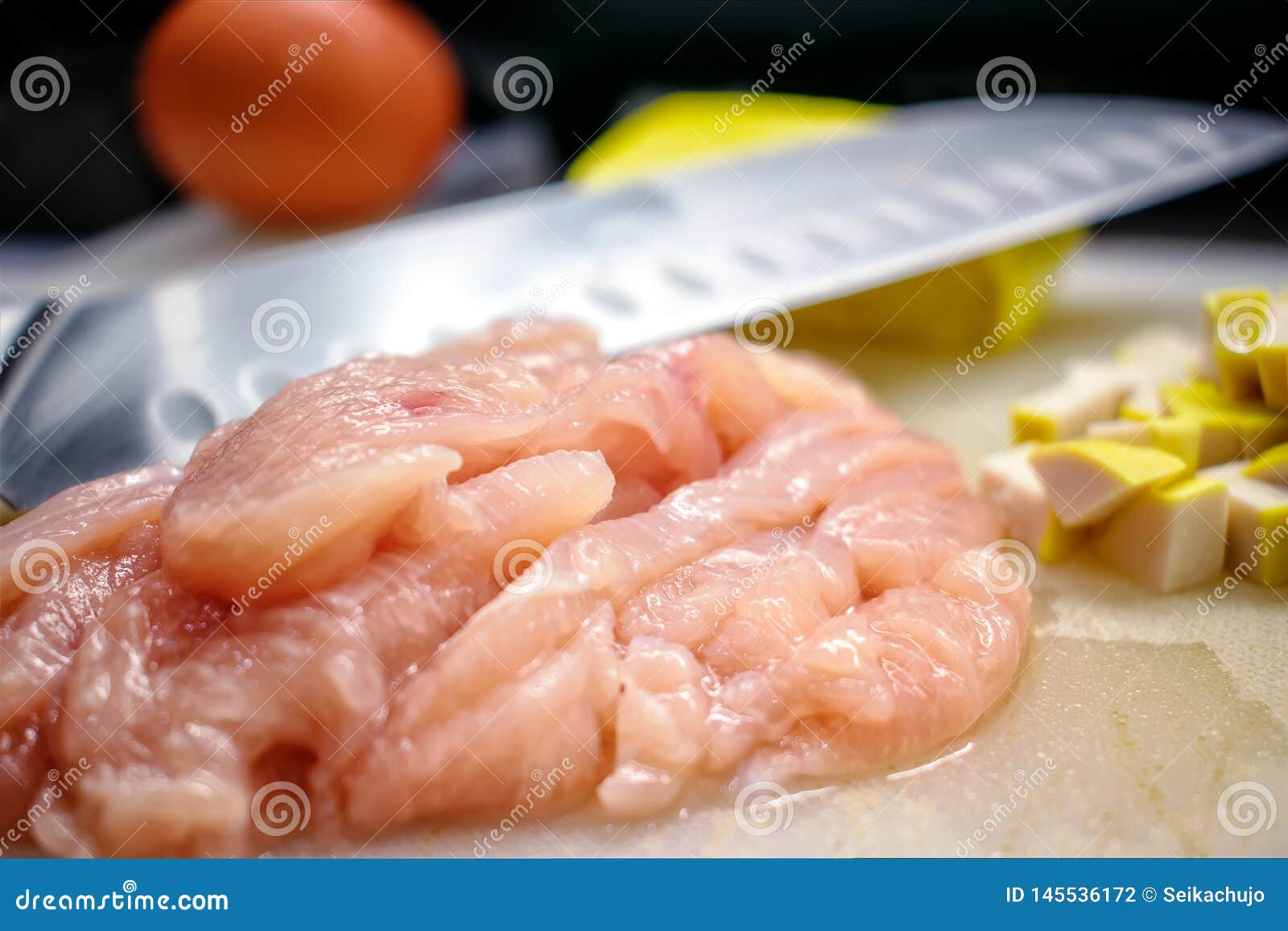 Food Preparation with Sliced Raw Chicken on a Cutting Board Stock Photo ...