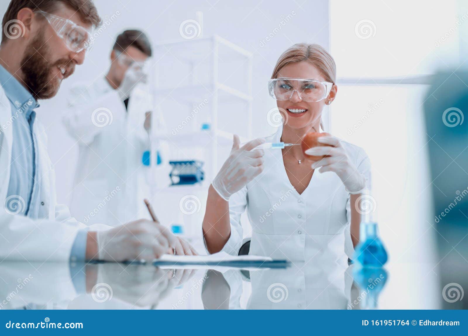 Food Quality Control. a Group of Scientists Testing the Fruit Stock ...