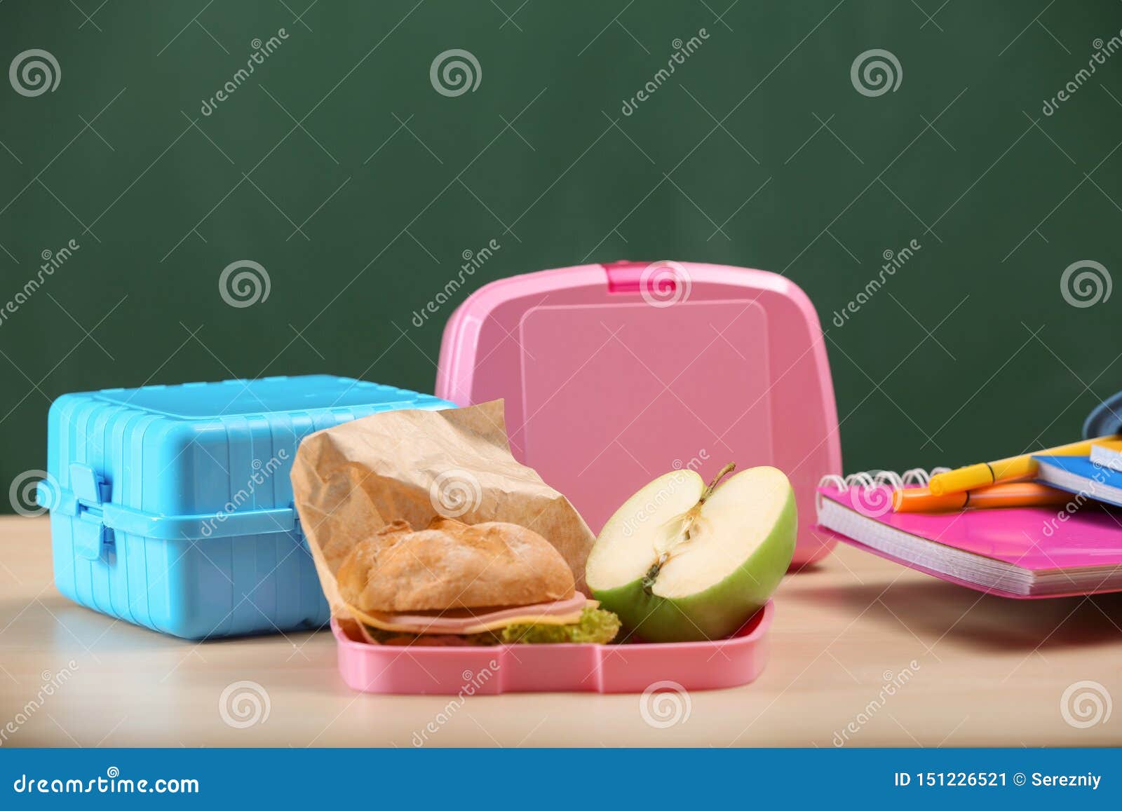 Food for Schoolchild in Lunch Boxes with Stationery on Table Stock ...