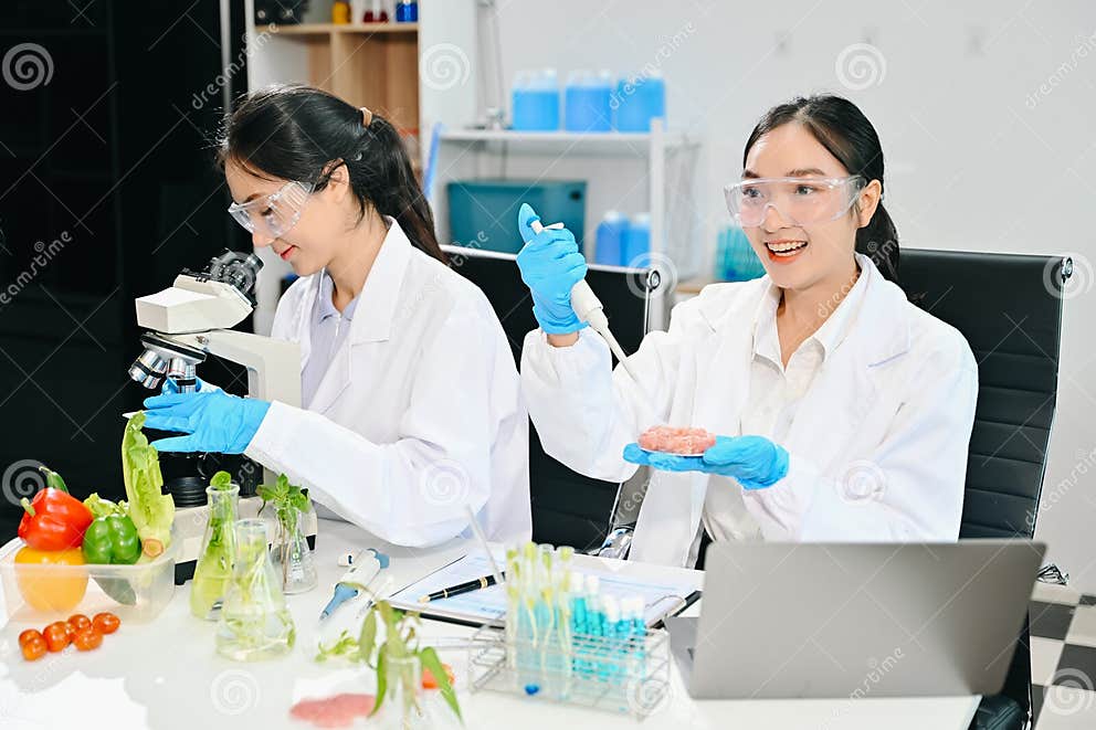 Food Scientists in Lab Coats, Testing Samples, and Analyzing Food ...