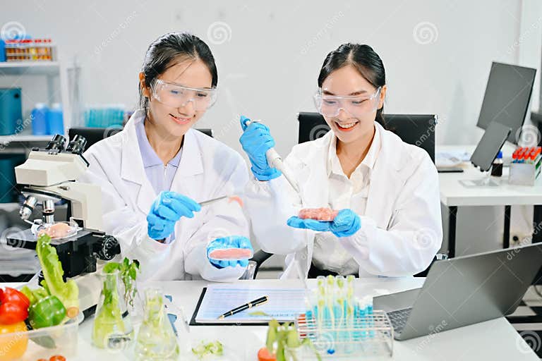 Food Scientists in Lab Coats, Testing Samples, and Analyzing Food ...