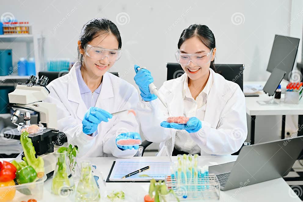 Food Scientists in Lab Coats, Testing Samples, and Analyzing Food ...