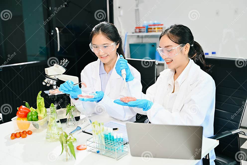 Food Scientists in Lab Coats, Testing Samples, and Analyzing Food ...