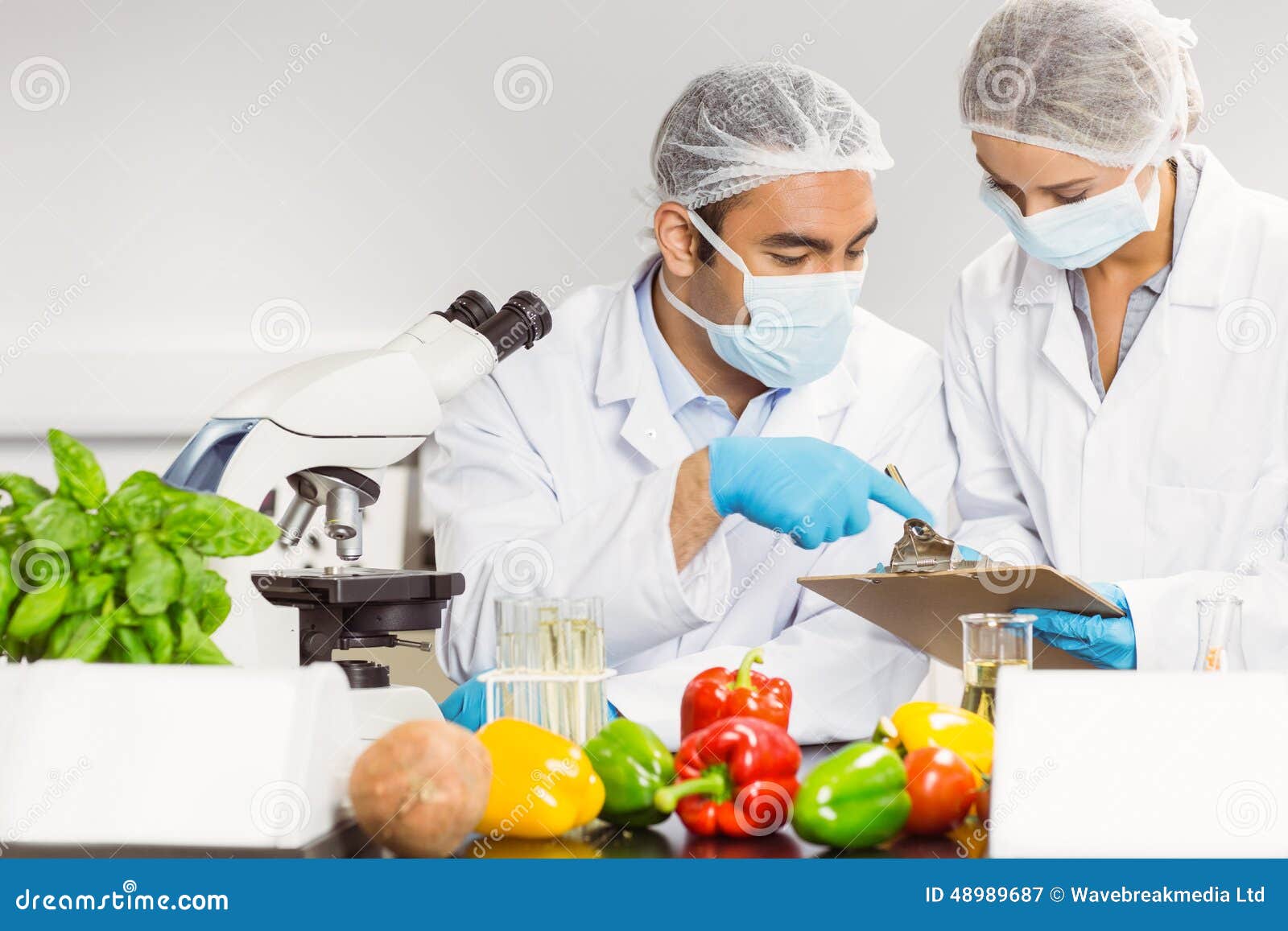 Food Scientists Using the Microscope for Research Stock Image - Image ... Food Scientists Using the Microscope for Research Stock Image - Image ...