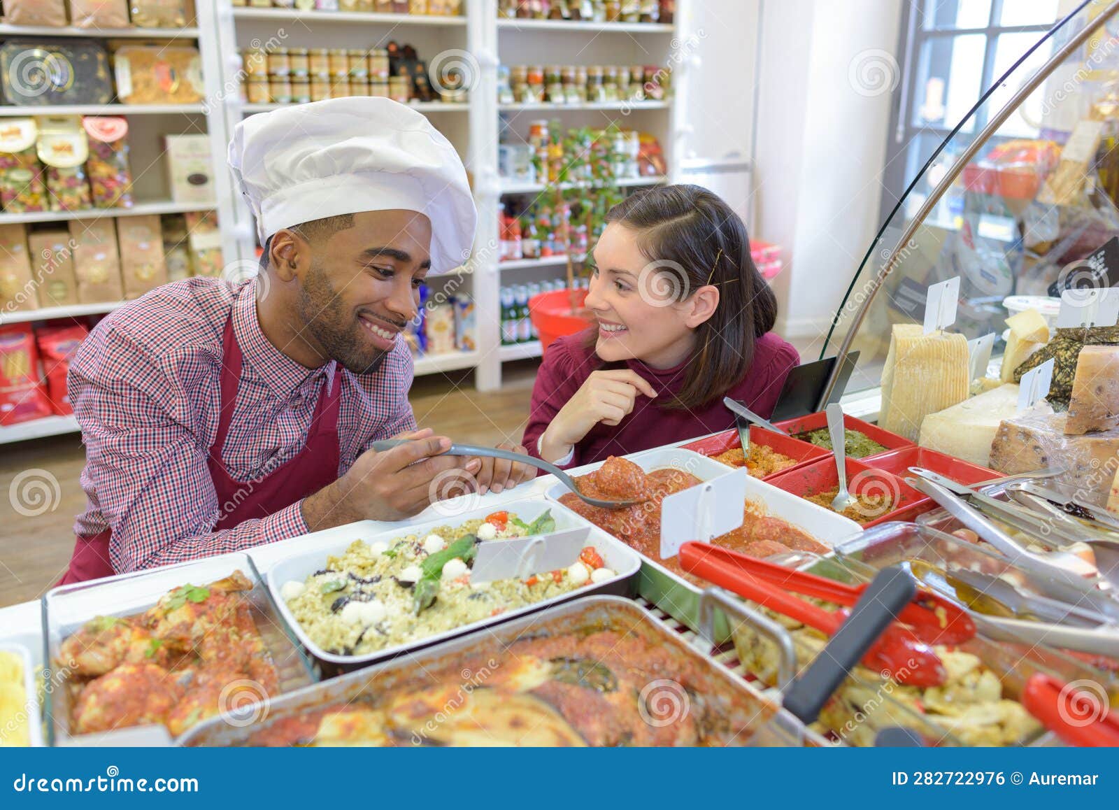 Foodstore Assistant Helping Customer Stock Photo - Image of veggies ...