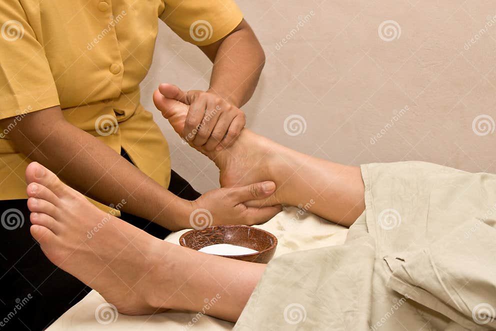 Foot massage in spa stock image. Image of reflexology - 5525169